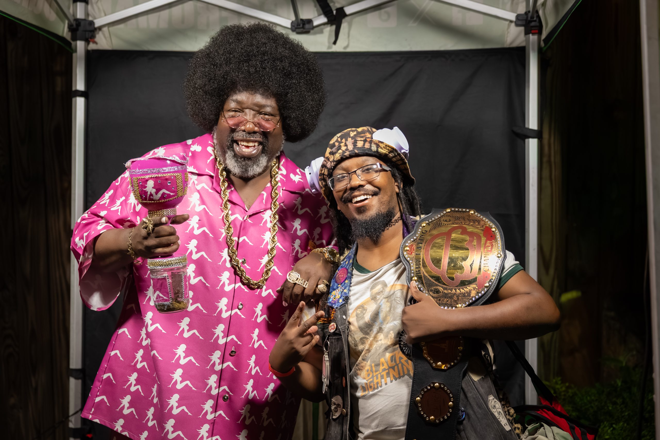 Aaron posing with Afroman and his belt from a local bun eating contest.